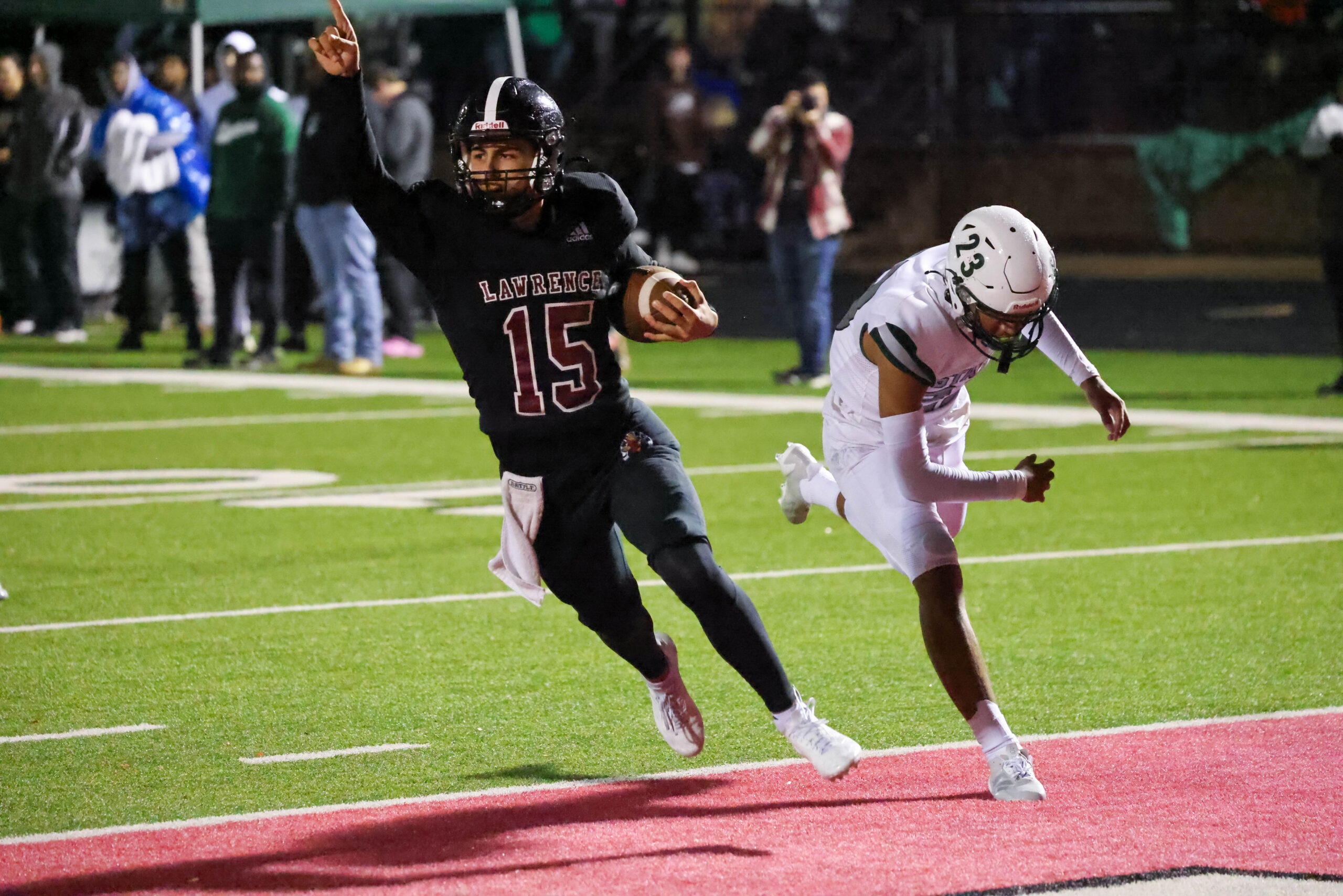City Showdown: Lawrence football gets first win of the season in 24-6 ...